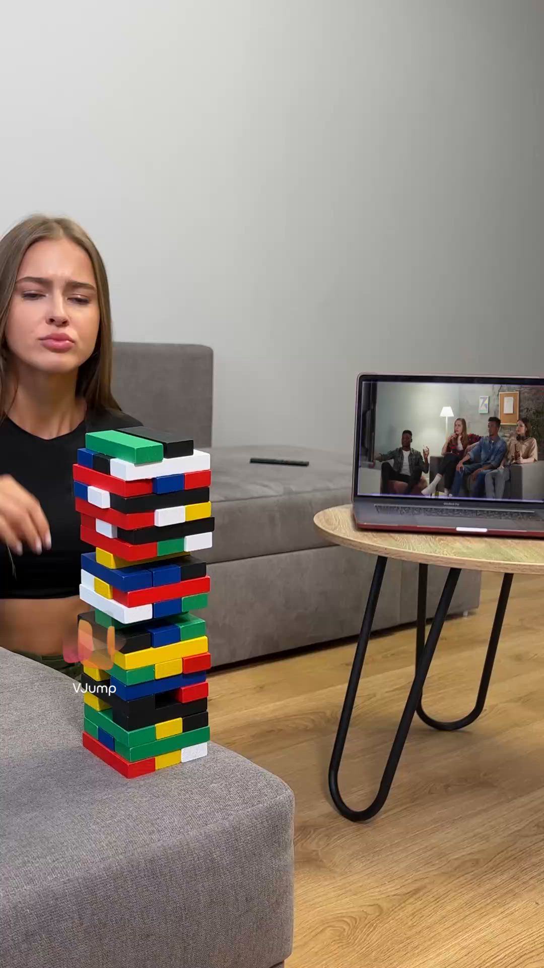 Friends from a laptop throw a bottle and destroy the tower from the ...